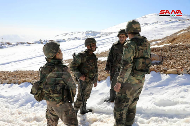Syrian Arab Army soldiers positioned in their sites at Jabal al-Shaikh ...
